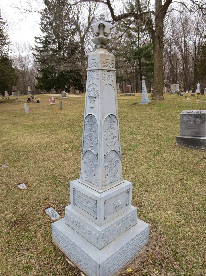 This ornate obelisk monument demonstrates the Victorian-era craftsmanship that makes Findlay Cemetery an outdoor museum of funerary art.