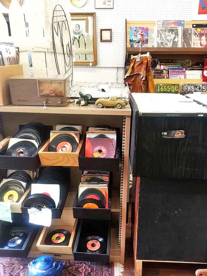 Vinyl records stacked like pancakes of musical history – each one a time machine to someone's first dance, heartbreak, or road trip.