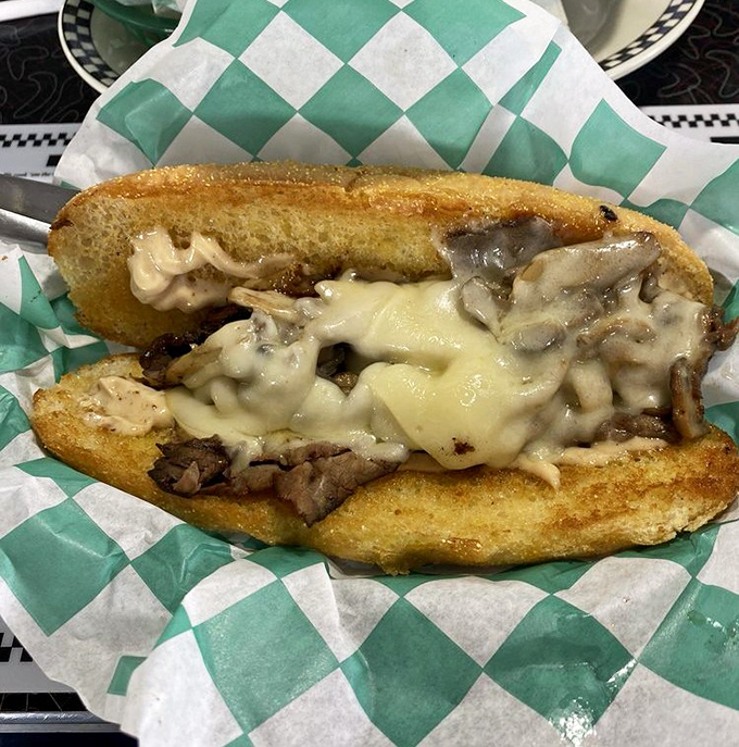 Melted cheese cascades over thinly sliced roast beef in this hoagie that doesn't just satisfy hunger &ndash; it creates food memories that last for decades.