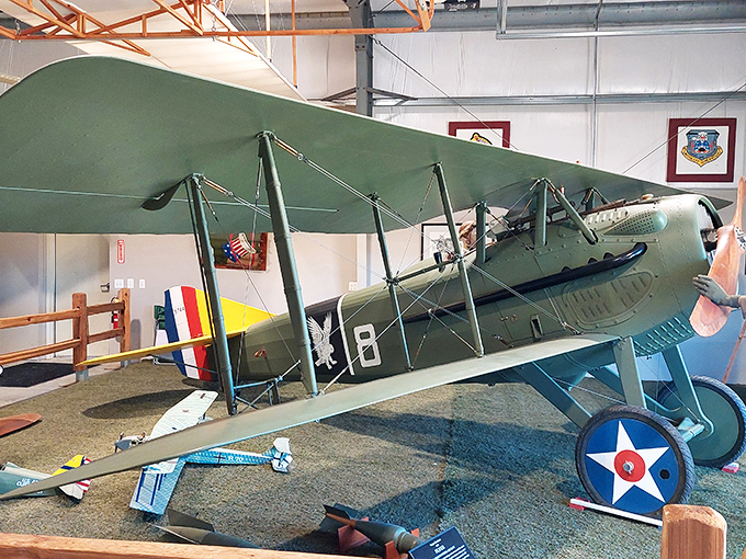 The delicate framework of this vintage biplane reveals aviation's elegant beginnings, when pilots flew with fabric, wood, and extraordinary courage.