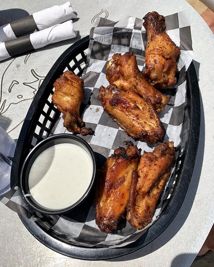 Smoked wings achieve that holy grail of wing perfection: crispy exterior, juicy interior, and flavor that makes sharing an act of true friendship.