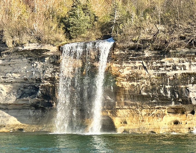Up close, the waterfall reveals its power and grace, hypnotizing visitors with its endless cascade into Lake Superior's depths.