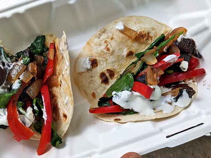 Vegetarians rejoice! These portabella tacos with vibrant peppers and creamy sauce prove meatless doesn't mean flavorless in this taco wonderland.