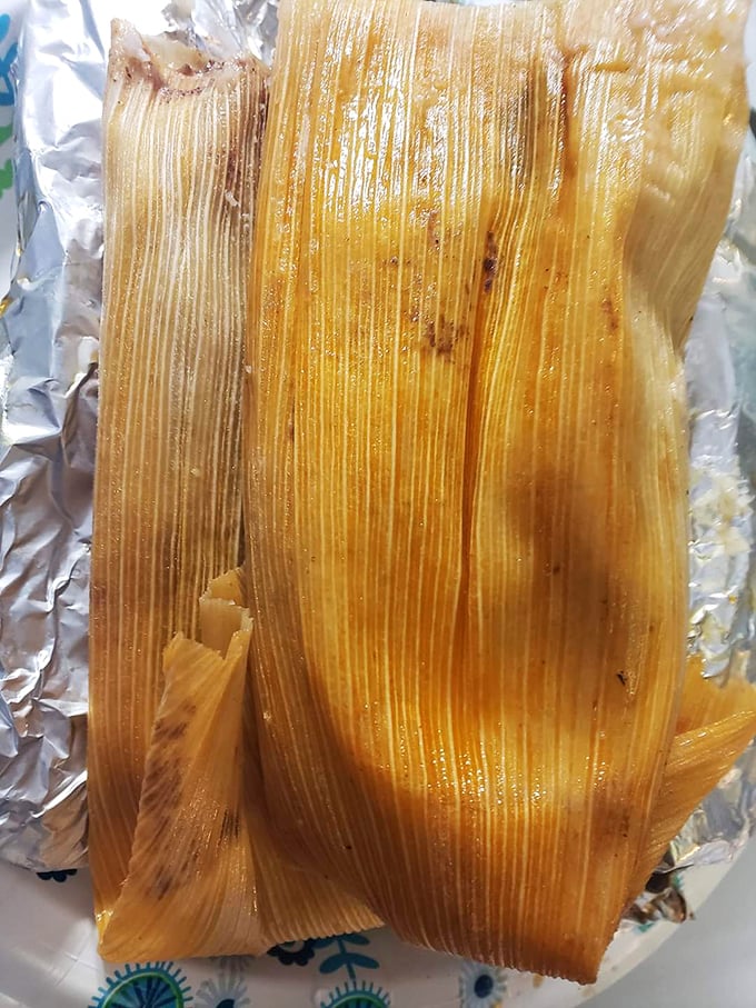 Behold the tamale in its natural habitat &ndash; corn husk wrapping protecting the steamed masa treasure within like nature intended.