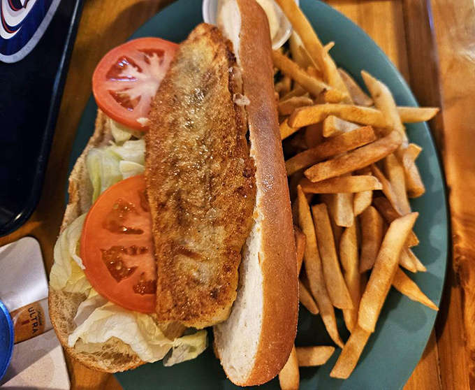 The walleye sandwich: Minnesota's unofficial state fish served on a soft bun with crispy fries. Lake country perfection.
