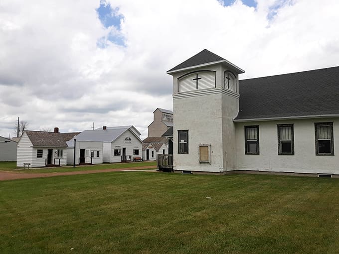 These pristine white structures lined up like soldiers showcase the architectural simplicity and practical beauty that defined frontier town planning and construction.