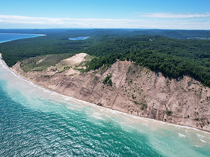 This aerial perspective reveals the dramatic meeting of forest, sand, and water that makes Sleeping Bear Dunes legendary.