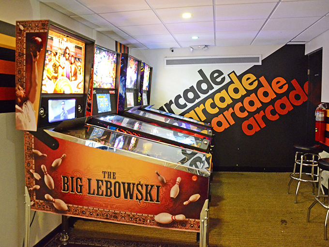The Big Lebowski pinball machine stands guard in the arcade area, a fitting tribute to bowling's most famous fictional enthusiast.