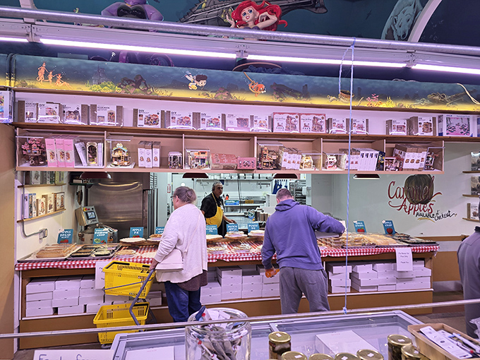 The caramel apple section – where fruit pretends to be healthy while dressed in its finest sugar coat and party toppings.