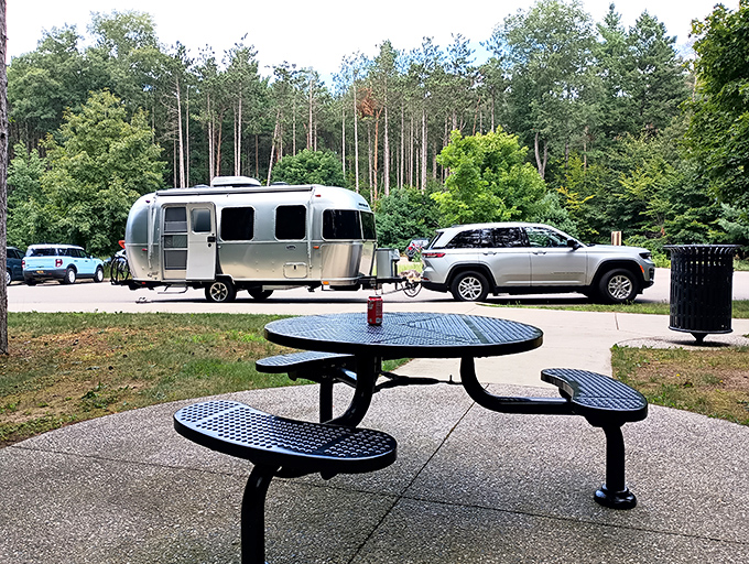 Home away from home &ndash; where silver campers nestle among towering pines.