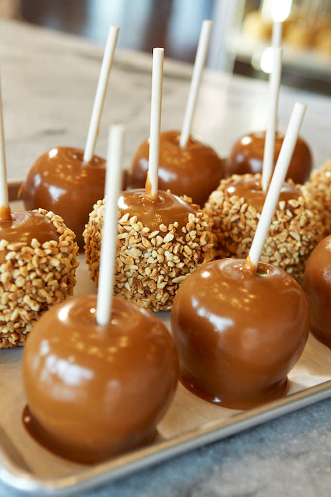 These aren't just caramel apples, they're architectural achievements where fruit somehow becomes dessert royalty.