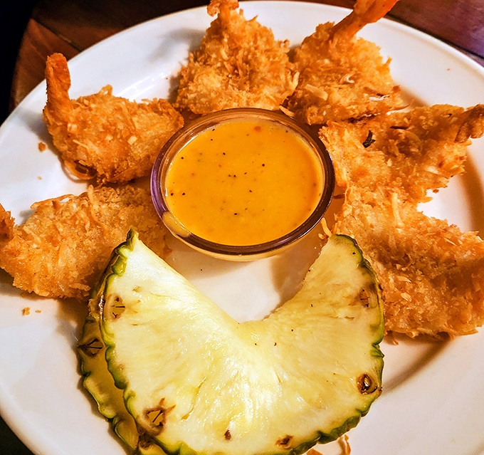 Coconut Shrimp that crunch like you're walking on pristine beach sand – golden-brown perfection with a side of paradise.
