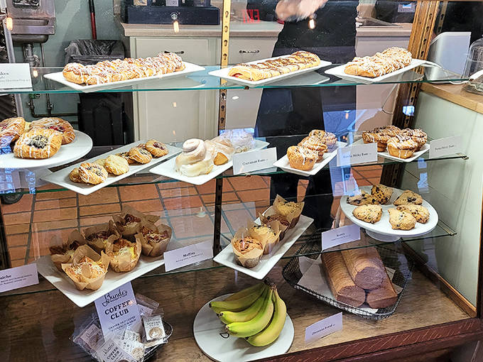 A treasure trove of freshly baked temptations awaits, each meticulously crafted pastry silently promising a moment of pure butter-laden bliss.