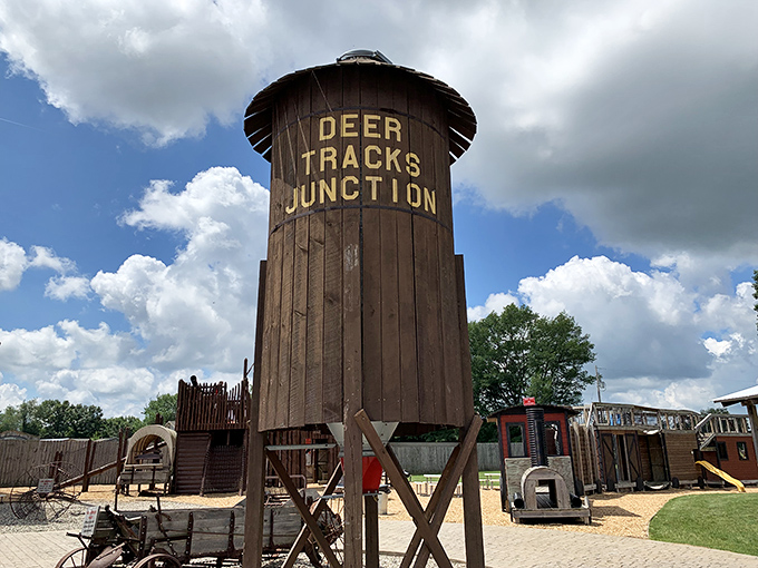 The iconic water tower stands sentinel over Deer Tracks Junction, promising wild adventures beyond its rustic wooden frame.