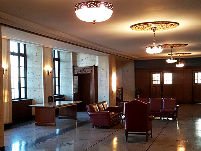 The grand lobby welcomes visitors with marble floors and leather furnishings that whisper of conversations and footsteps from nearly a century past.