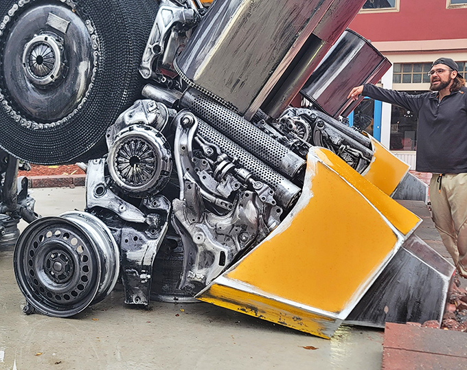 Visitors can appreciate the incredible scale and craftsmanship up close, examining how everyday auto parts have been reimagined into something extraordinary.