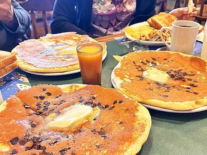 The table groans under the weight of multiple plate-sized pancakes - a breakfast spread that could feed a small lumberjack camp.