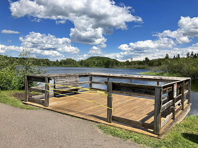 This lakeside observation deck offers panoramic views that would make your smartphone camera weep with inadequacy and your soul sing with joy.
