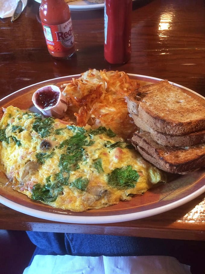 This isn't just an omelet &ndash; it's a fluffy envelope of morning joy, delivering vegetables and cheese alongside perfectly crisped toast.