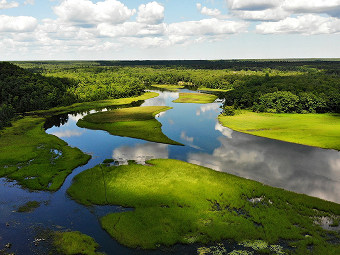 Mother Nature's infinity pool, where the water meets sky in a seamless blend that makes you question where one ends and the other begins.