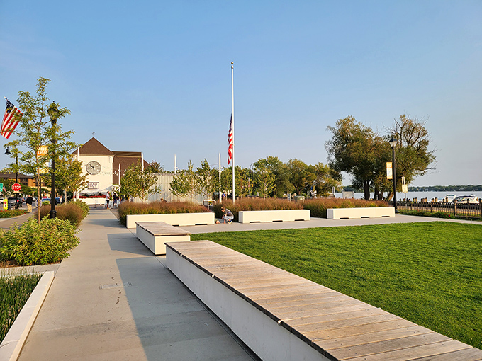 The lakefront park provides a green oasis where families gather and memories are made against a backdrop of sparkling water.