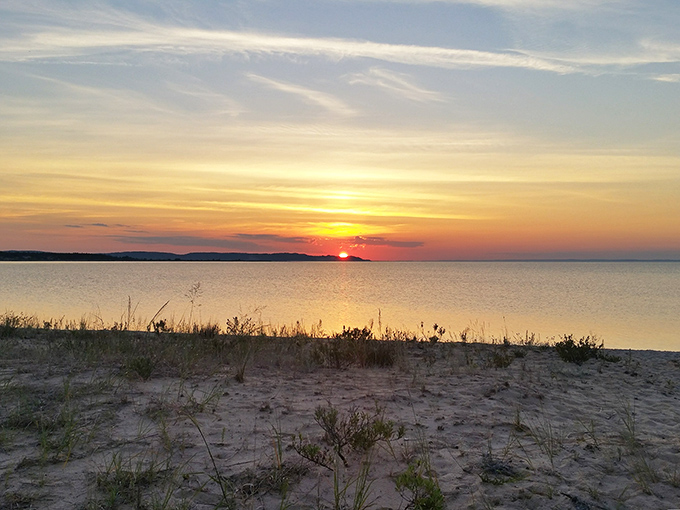 Day's end brings a painter's palette to the horizon, as the sun bids farewell with a spectacular light show.