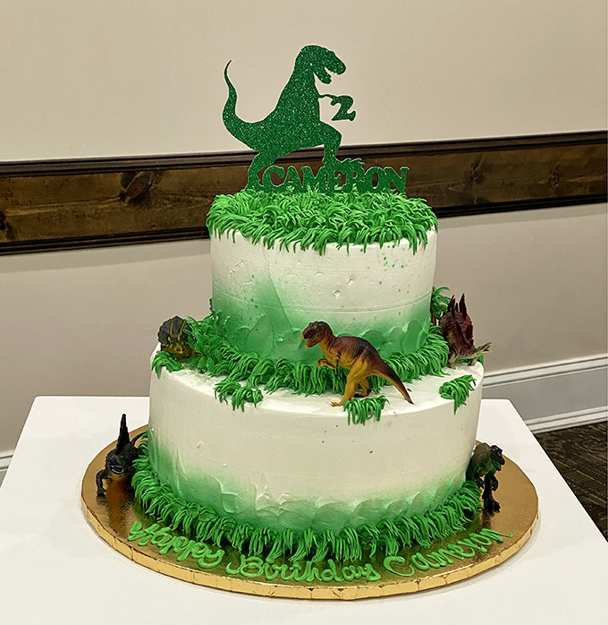 Birthday dreams come true with this two-tiered dinosaur masterpiece. The green frosting "grass" and tiny dino figurines make extinction look delicious!
