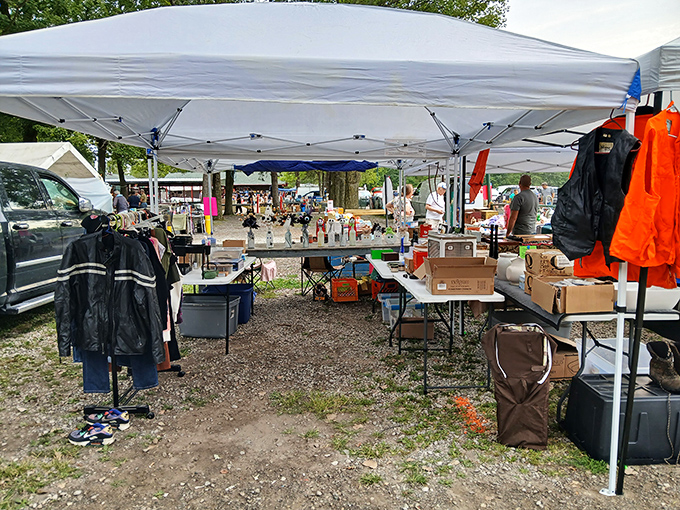 A typical vendor stall reveals the beautiful chaos of flea market shopping, where unexpected treasures hide in plain sight.