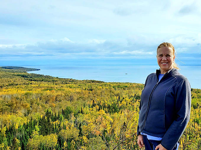 A gentleman stands proudly beside his automotive treasures, his collection representing decades of passionate preservation.