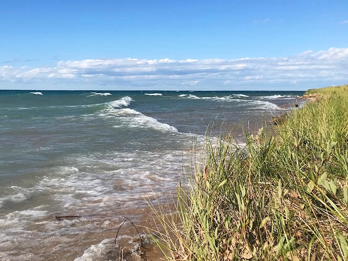 The Great Lakes show their power as waves crash against the shoreline, a hypnotic rhythm that's been playing for millennia.