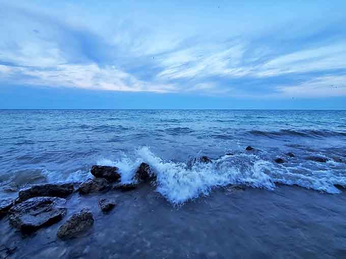 Lake Huron shows its wilder side as waves crash against ancient rocks, a hypnotic display of nature's raw power.