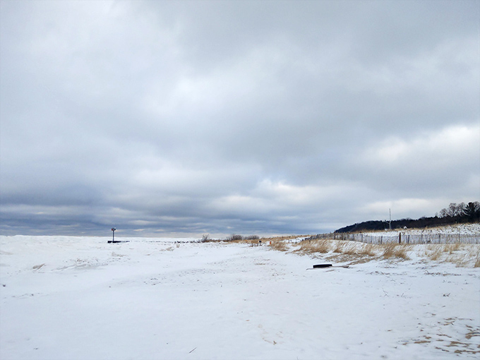 Winter transforms Van's Beach into a snow-globe wonderland where brave souls find solitude and ice formations create natural sculptures.