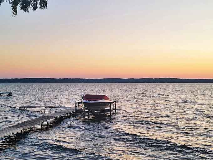 Sunset transforms this weathered dock into pure Michigan poetry &ndash; the perfect spot for contemplating life with your feet dangling in the water.