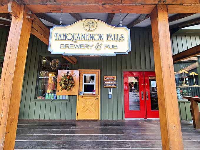 Tahquamenon Falls Brewery & Pub welcomes hungry travelers with rustic charm and handcrafted brews. The wooden sign swinging from timber beams sets the north woods mood.