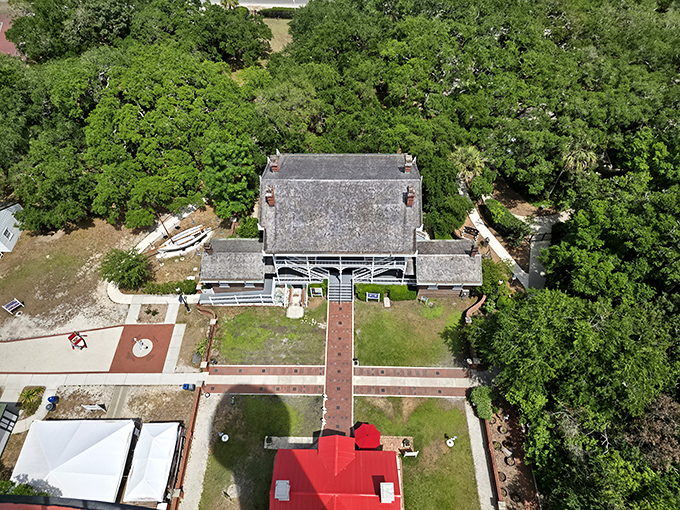 Aerial view reveals the keeper's quarters and surrounding grounds, where families once lived in service to sailors they would never meet.