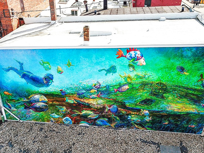 Sunlight plays across the mural's surface, transforming painted water into something that almost seems to ripple and flow with Michigan breezes.