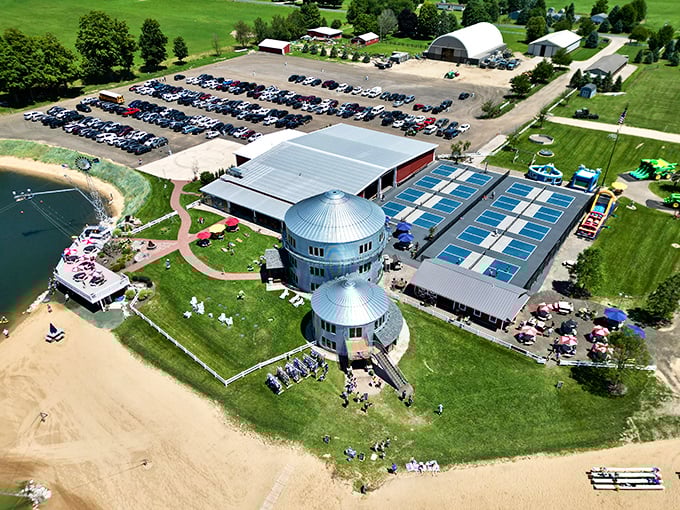 Aerial perspective showcases Lake Arvesta's impressive scale, where water activities, sports facilities, and natural beauty create a recreational trifecta.