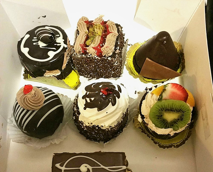 These miniature cakes aren't just desserts; they're edible art pieces where every swirl, chocolate drizzle and fresh fruit garnish serves a purpose.