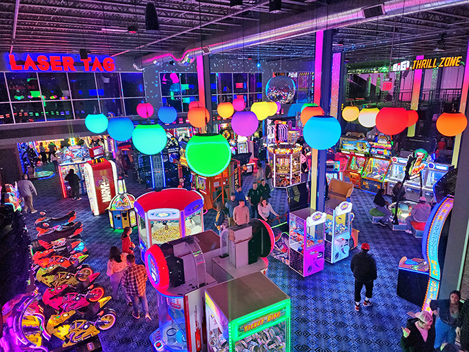 The arcade buzzes with neon lights and electronic melodies, a playground where both kids and adults surrender to the joy of games.