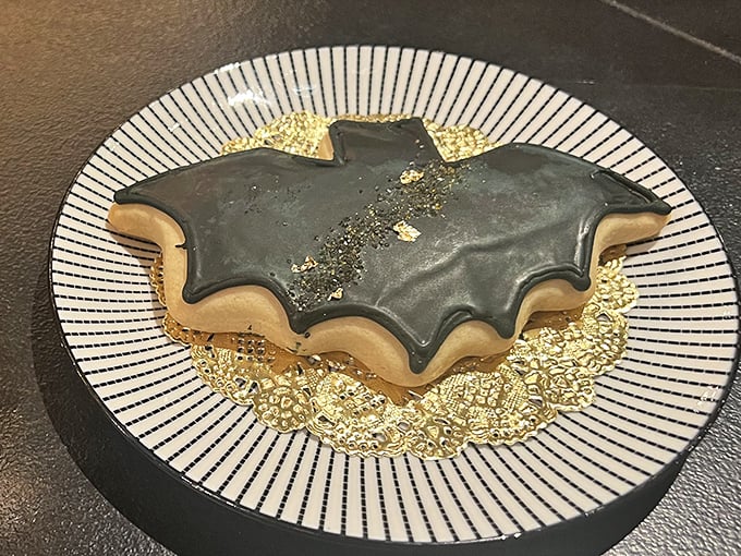 A bat-shaped cookie glazed to Gothic perfection proves themed treats can be as delicious as they are Instagram-worthy.