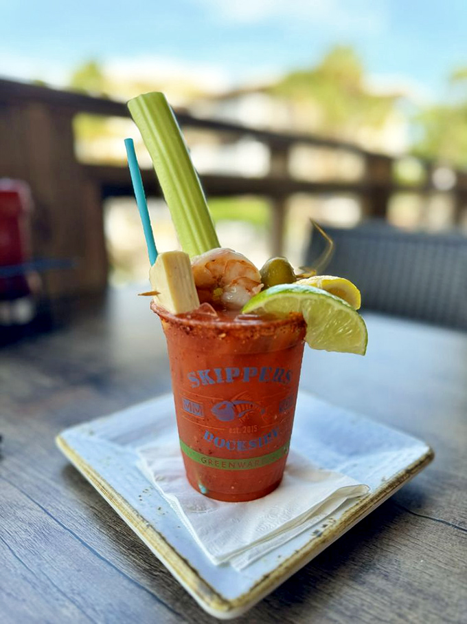 This Bloody Mary isn't just a drink &ndash; it's practically a seafood appetizer with a cocktail chaser, garnished like it's headed to a red carpet event.