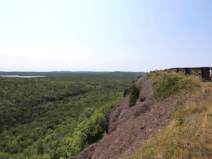 Rugged cliffs plunge dramatically to the forest below, a geological masterpiece millions of years in the making.
