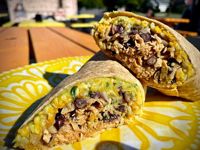 Cut this burrito in half and witness the cross-section of culinary genius &ndash; layers of flavor wrapped in a warm tortilla hug.