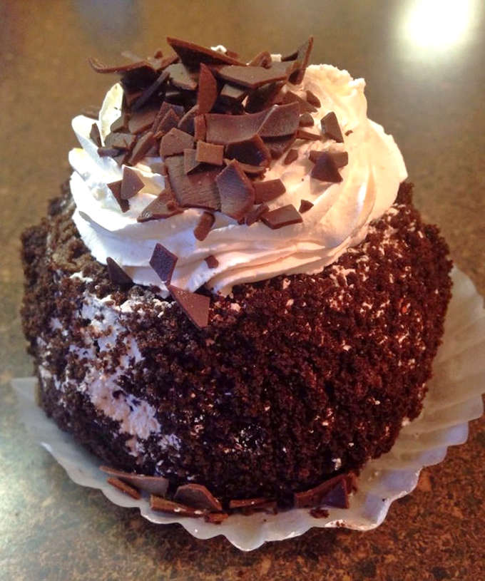 This chocolate cupcake isn't just dessert, it's therapy without the hourly rate &ndash; topped with a swirl of frosting that defies gravity.