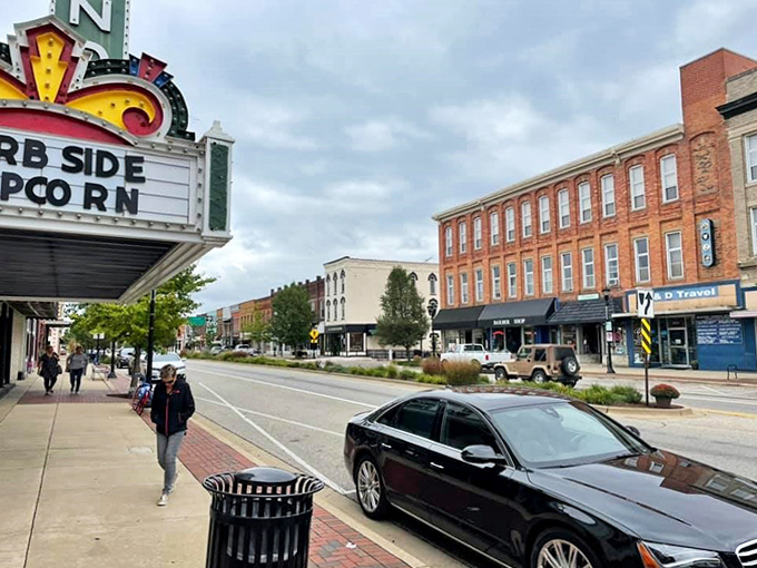 The historic theater marquee stands as a beacon of community entertainment, where generations have shared laughter and tears together.
