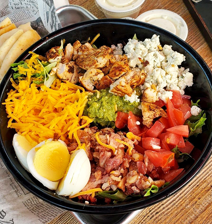A colorful protein party in a bowl, this Cobb salad balances virtue and indulgence with every perfectly arranged bite.