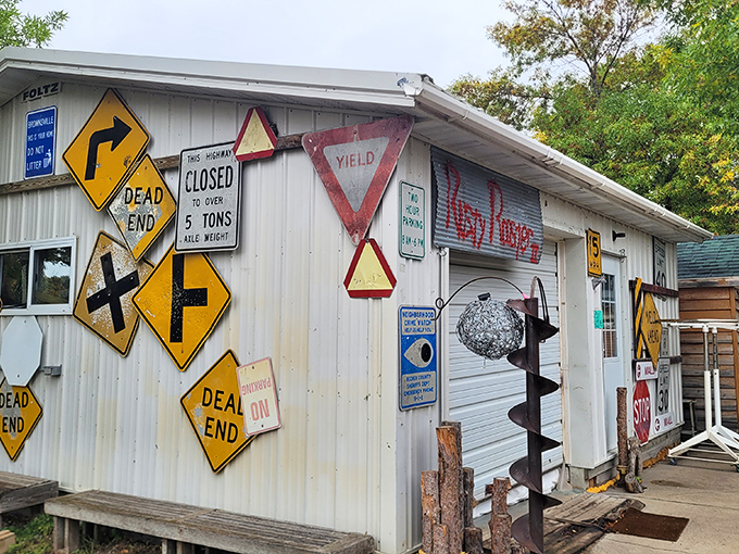 This building's exterior serves as a gallery of vintage road signs, where "Dead End" and "Yield" take on new decorative lives.