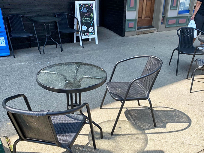 Outdoor seating that says "stay a while" without any of the fuss, just simple chairs and tables for enjoying your treats.