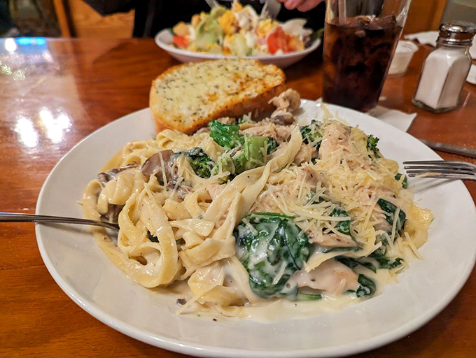 Fettuccine that's dressed to impress, with tender chicken and vegetables swimming in a creamy sauce that clings to every strand.