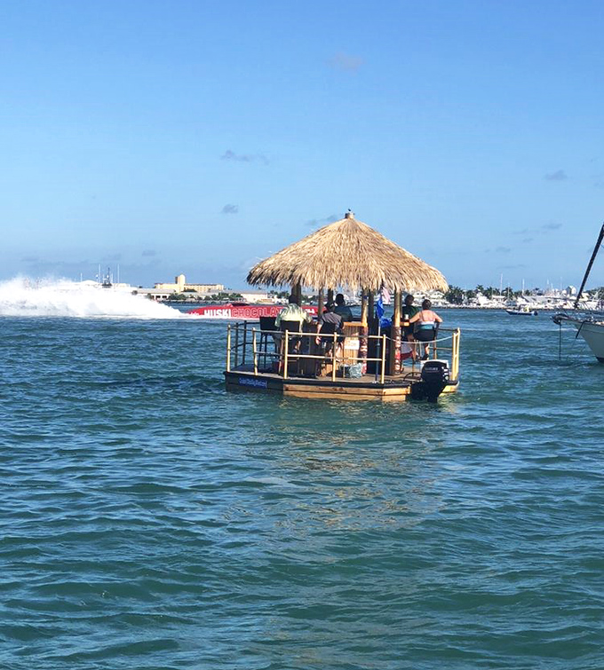 Captain at the helm, this floating tiki bar navigates the calm waters with ease, creating a gentle ride suitable for all ages.